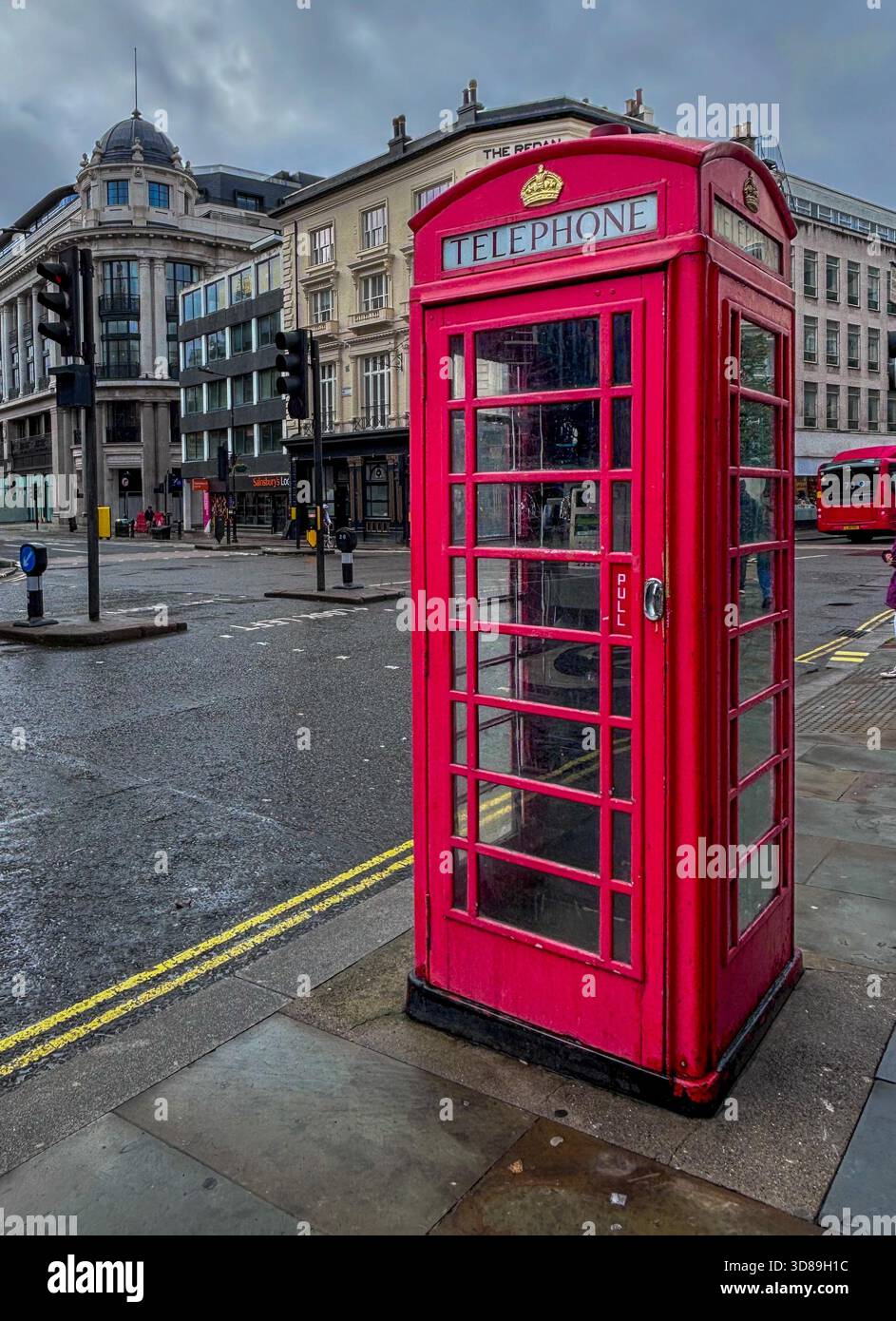 K2 Red Telephone Box on a Rainy City Street with Traffic Signals Stock ...
