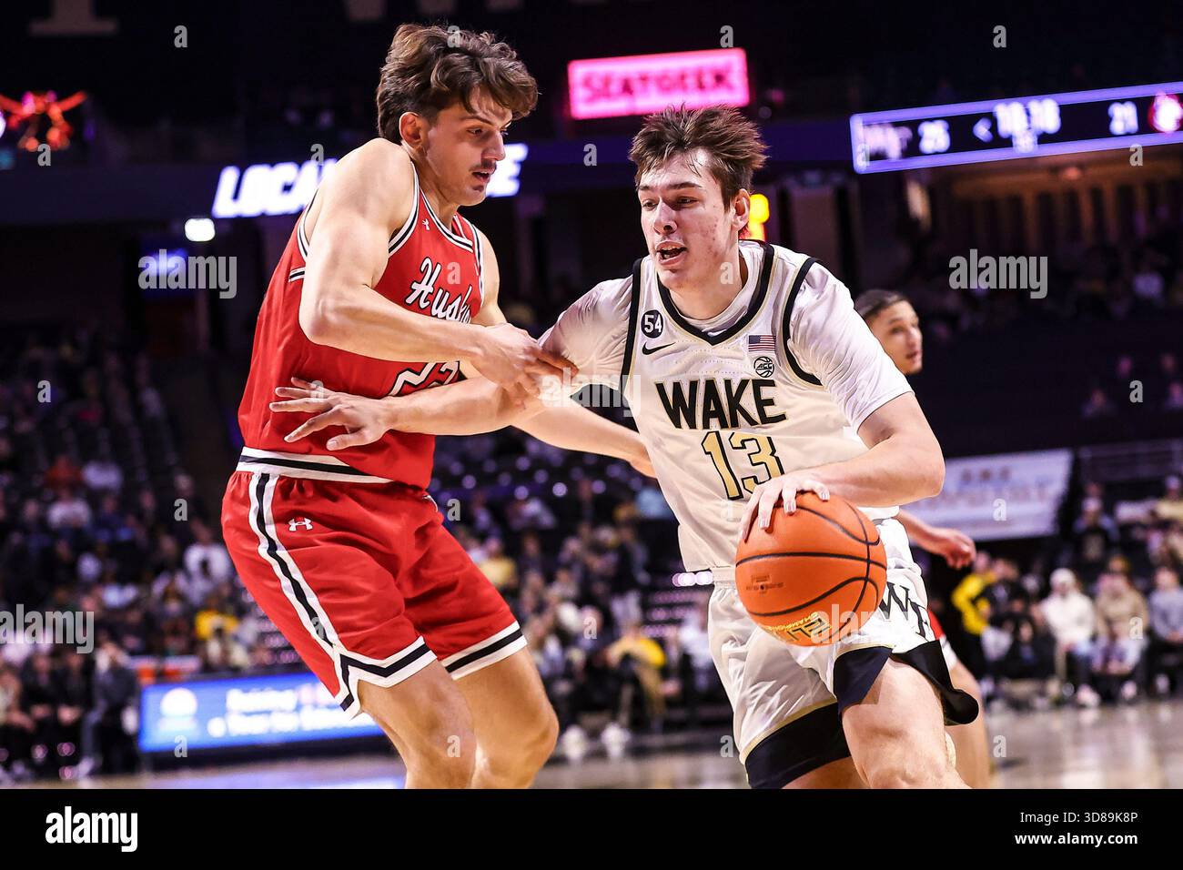 November 28, 2025: Wake Forest forward Cooper Schwieger (13) drives to ...