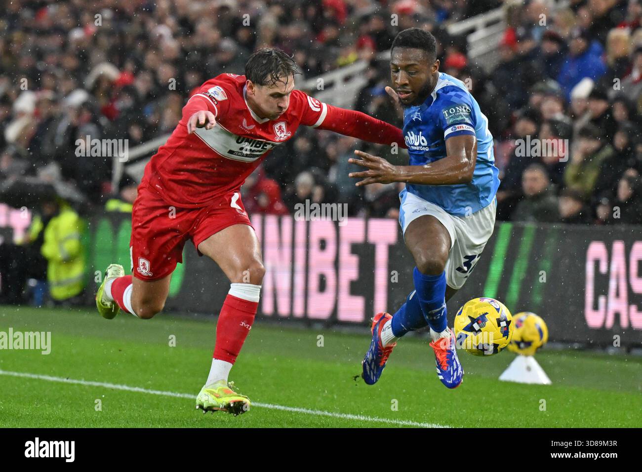 Middlesbrough's Callum Brittain (left) and Derby County's Ebou Adams ...