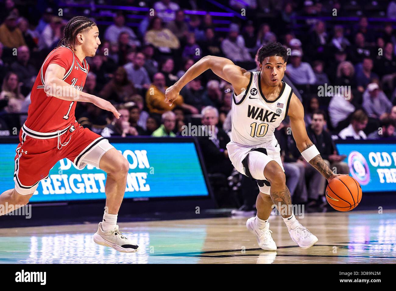 November 28, 2025: Wake Forest guard Sebastian Akins (10) dribbles past ...