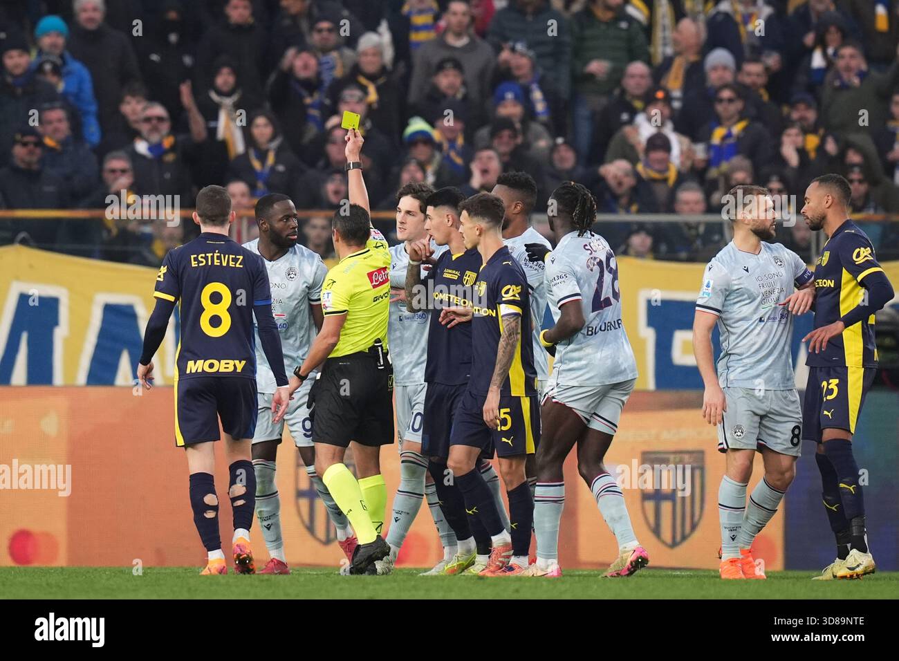 The referee Marco Piccinini gives a yellow card to Udinese's Keinan ...