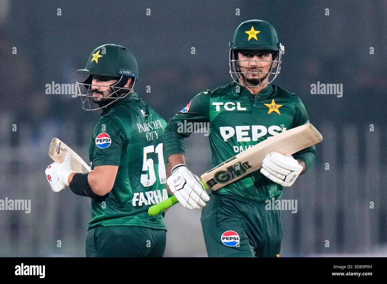 Pakistan's Saim Ayub, right, and Sahibzada Farhan, left, run between the wickets during the ...