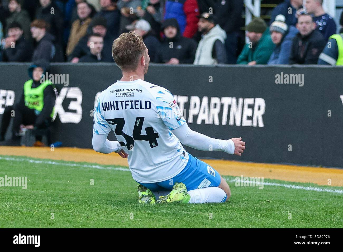 34, Ben Whitfield of Barrow AFC celebrates the goal on his knees during ...