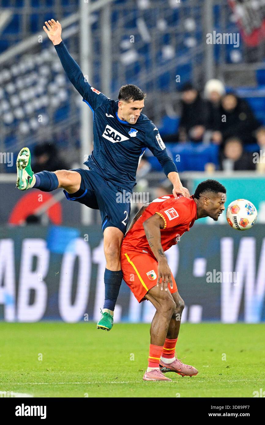 Hoffenheim's Robin Hranac, left, and Augsburg's Samuel Essende in ...
