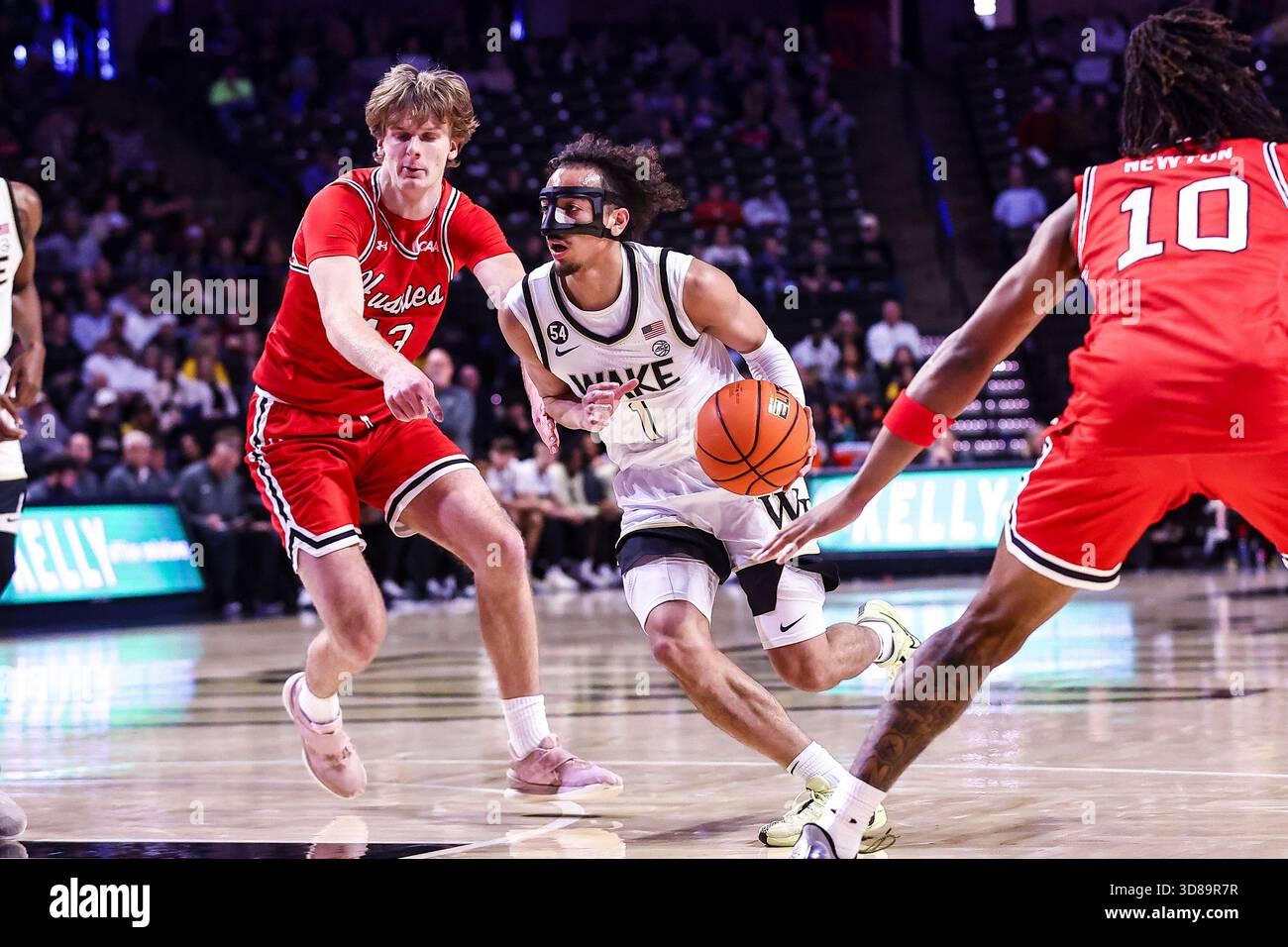 November 28, 2025: Wake Forest guard Nate Calmese (1) drives to the ...
