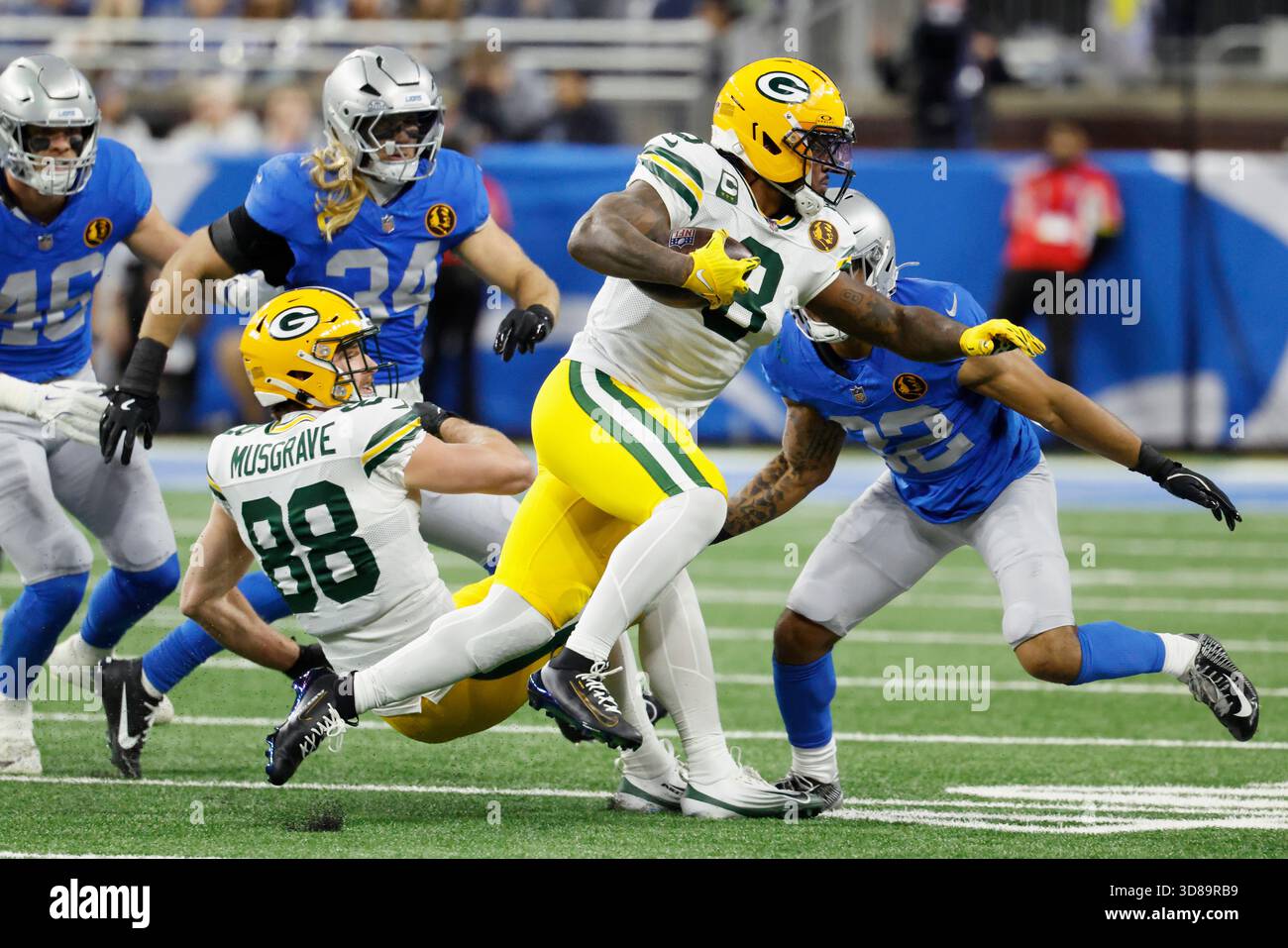 Green Bay Packers running back Josh Jacobs (8) rushes against the ...