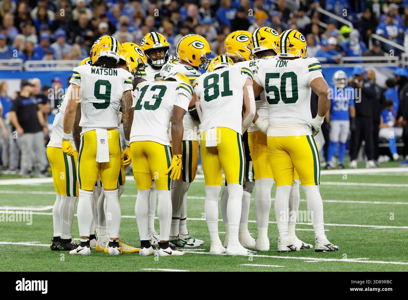 Green Bay Packers huddle up on offense against the Detroit Lions during ...