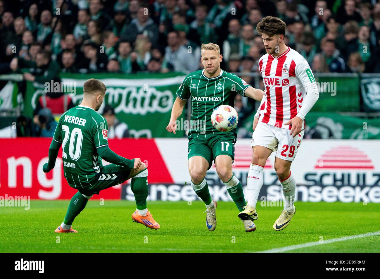 Jan Thielmann (1. FC Cologne, #29) dribbling against Romano Schmid (SV ...