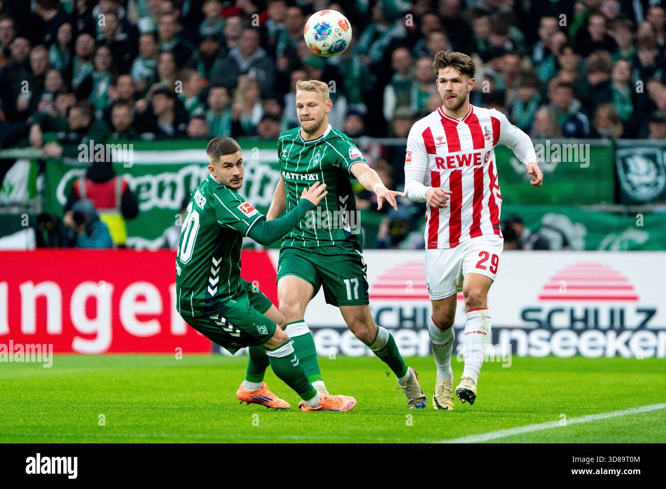 Jan Thielmann (1. FC Cologne, #29) dribbling against Romano Schmid (SV ...
