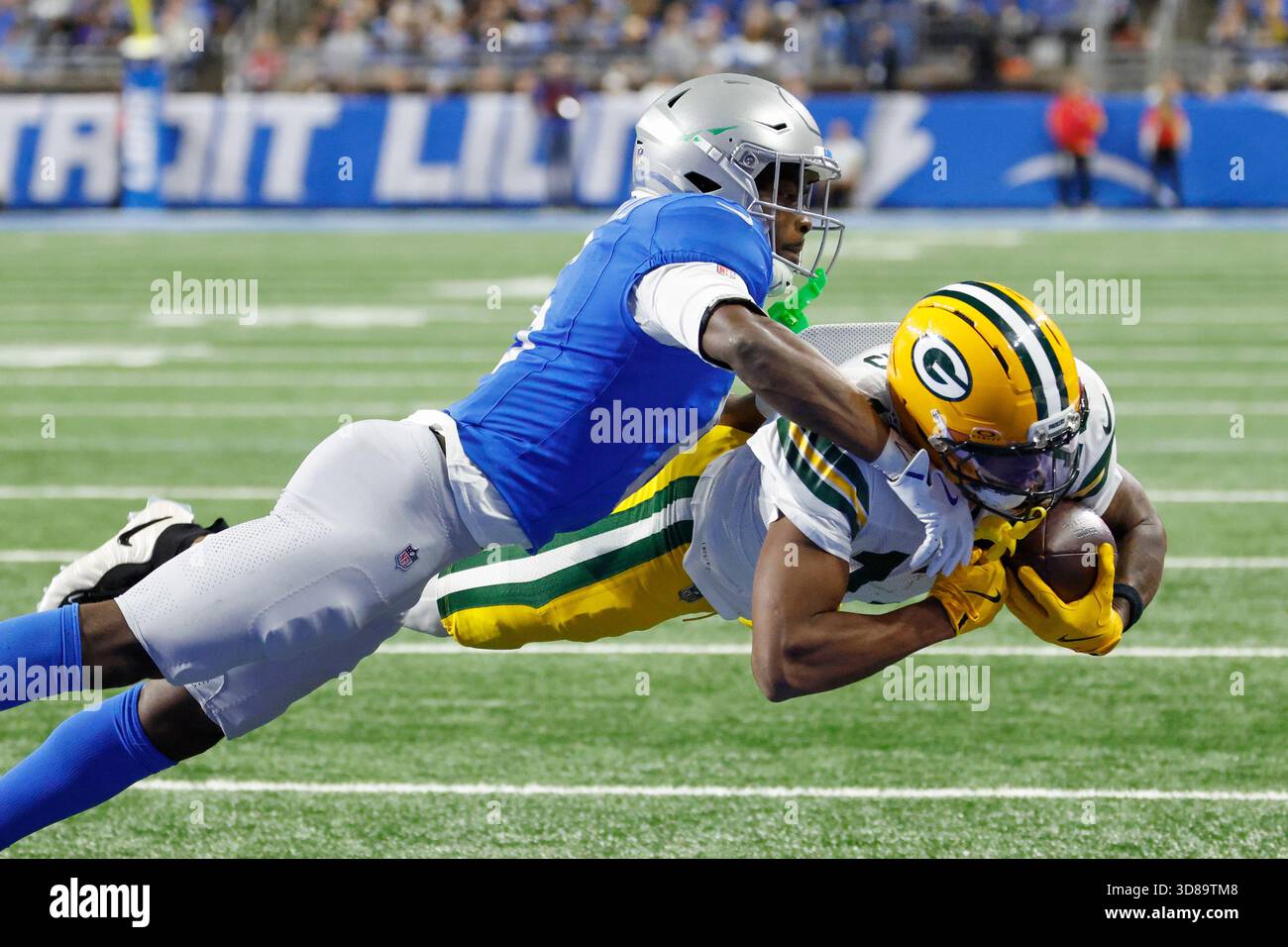 Green Bay Packers wide receiver Dontayvion Wicks (13) dive in for a ...
