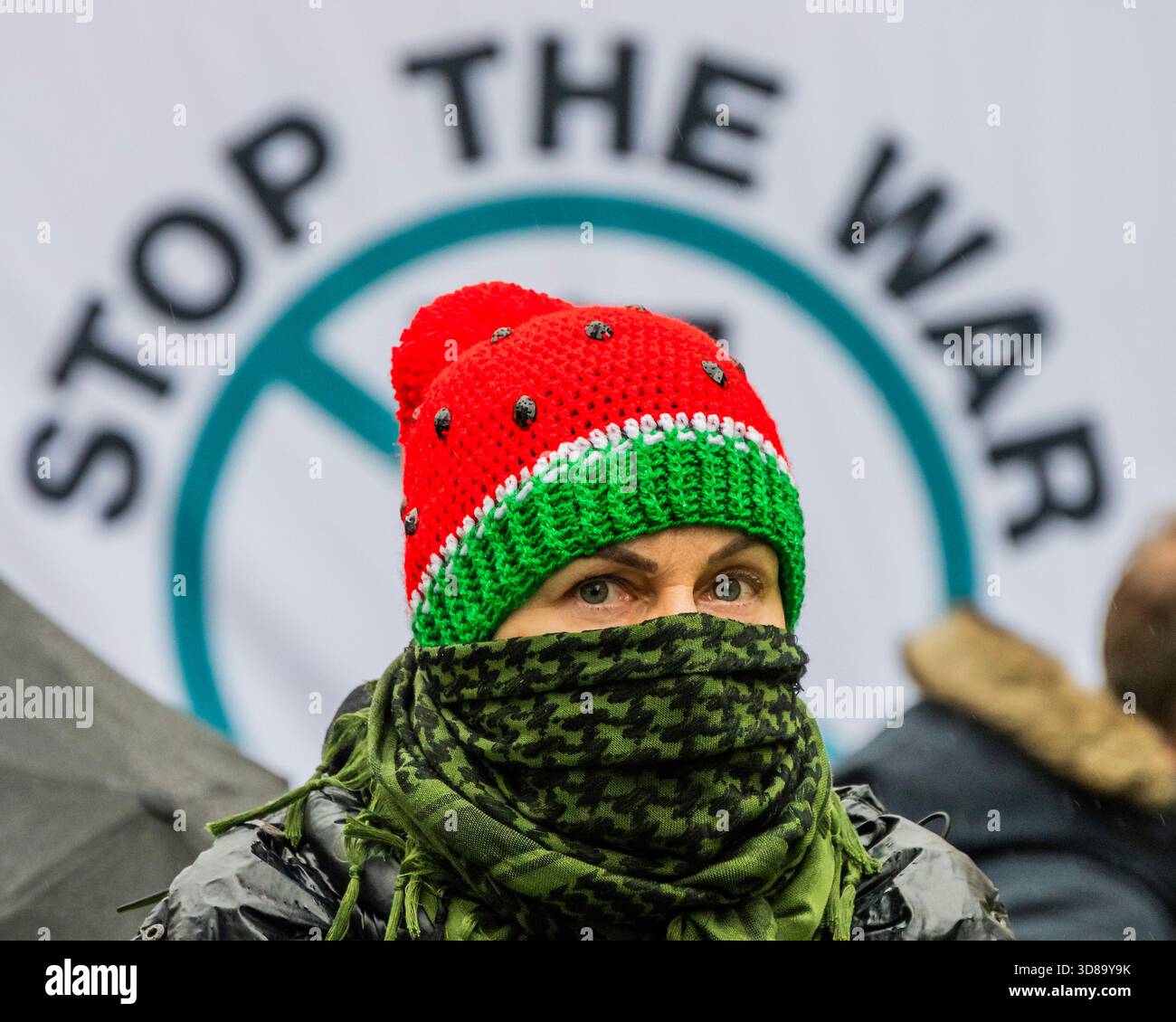 A water mellon (pro palestine symbol) bobble hat in front of the stop ...