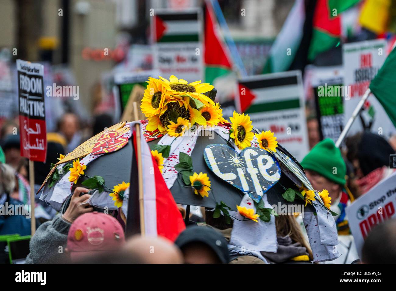 A 'Life over death' umbrella in the crowd - On the UN's International ...