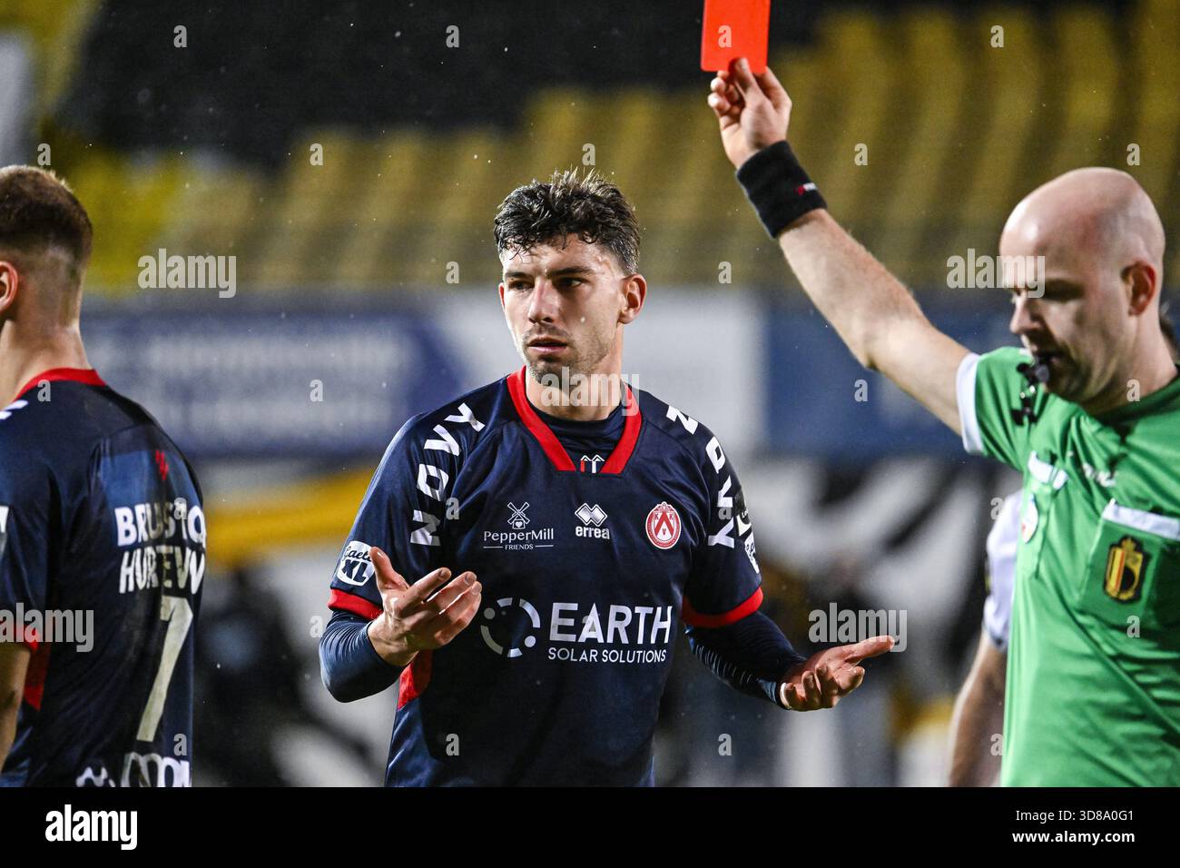 Kortrijk's Lennard Hens receives a red card from the referee during a ...