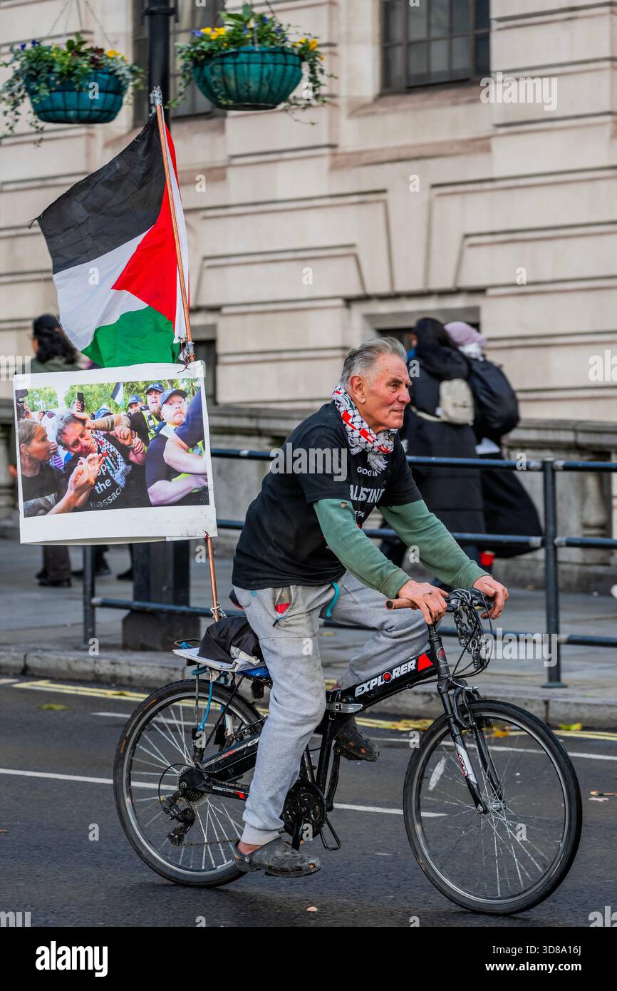 A man cycles with a picture of himself being grabbed by the police - On ...