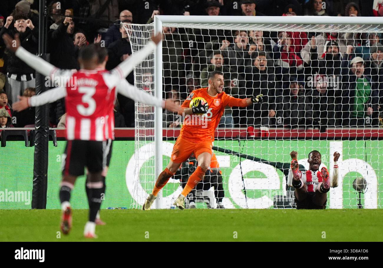 Brentford's Dango Ouattara (right) reacts after being fouled that ...