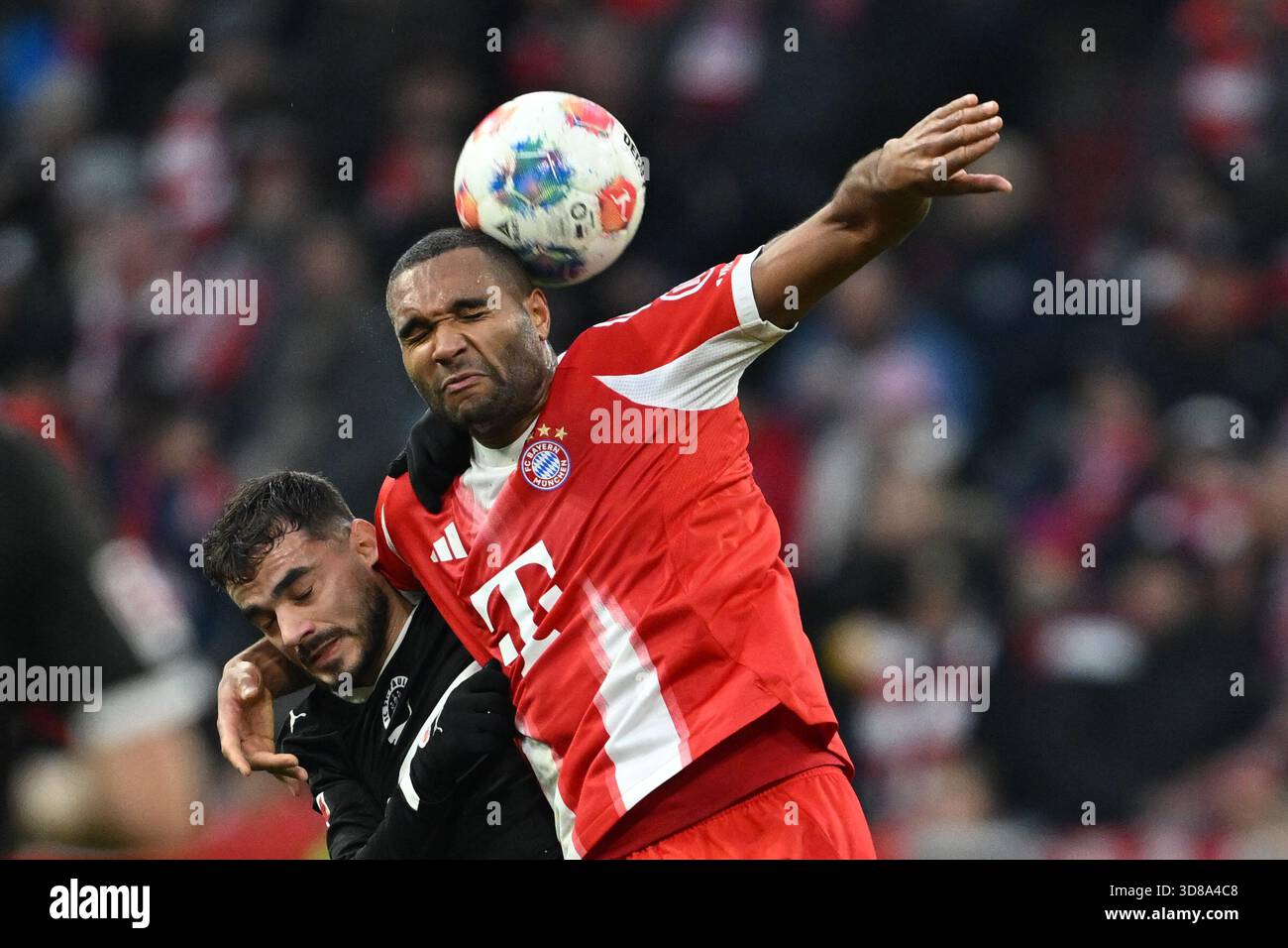Bayern Munich's Jonathan Tah and St. Pauli's Danel Sinani, left, in ...