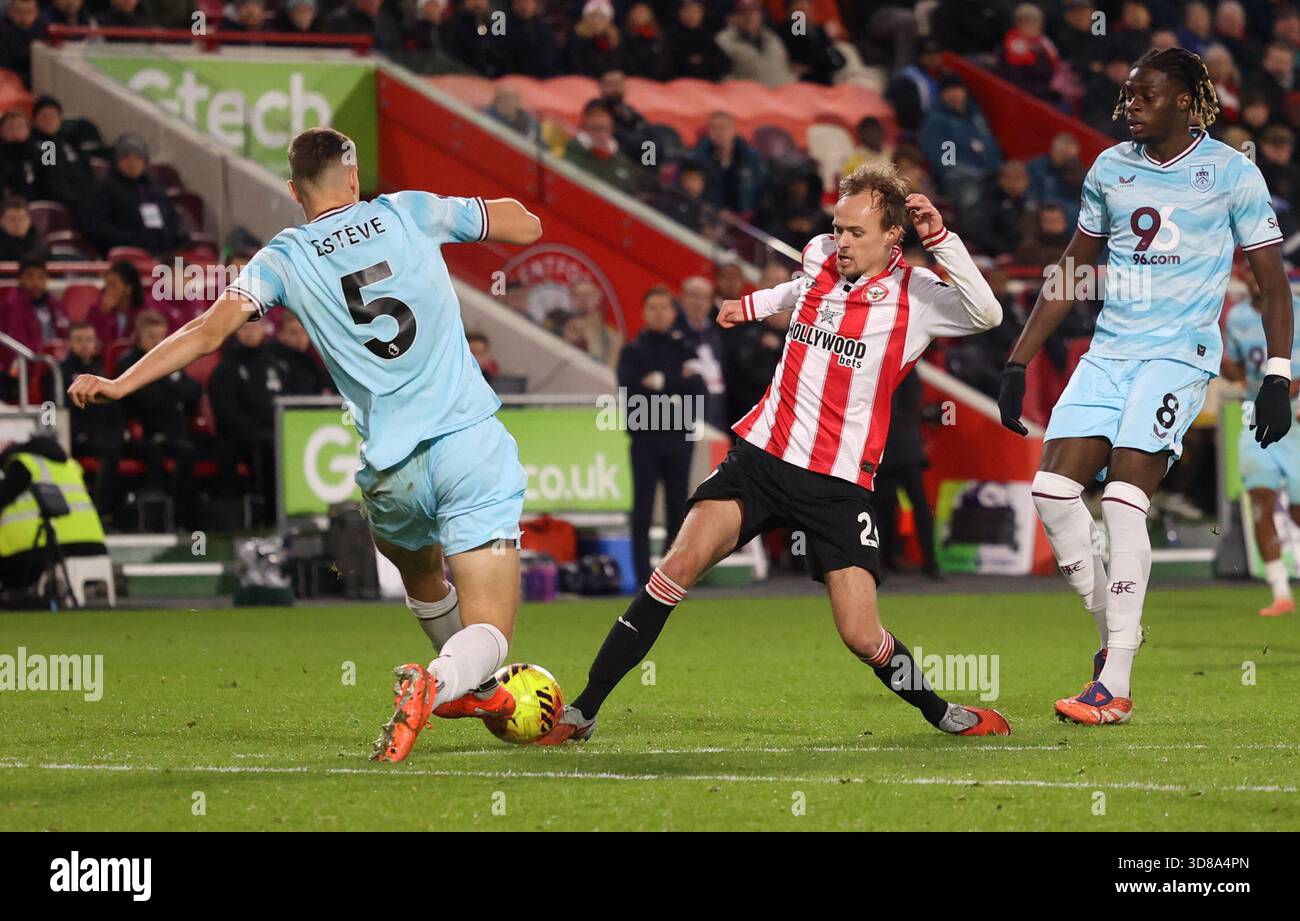 Burnley's Maxime Esteve (left) challenges Brentford's Mikkel Damsgaard ...