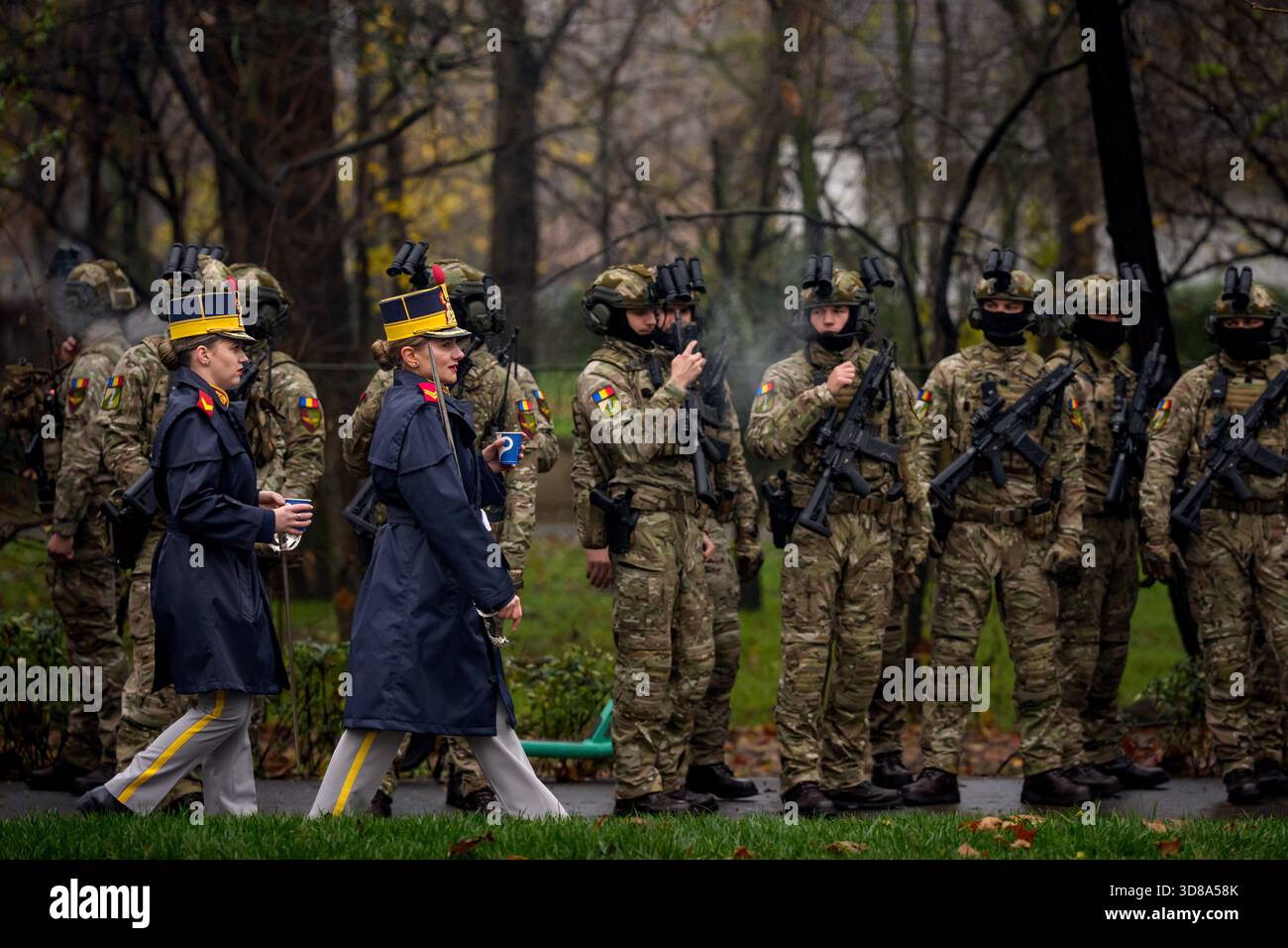 Servicewomen of the 30th Guard Regiment walk by members of Romania's ...