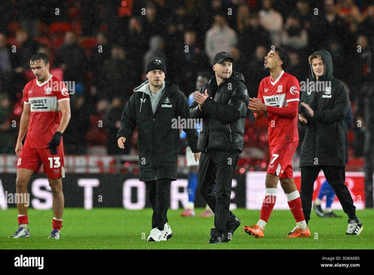 Middlesbrough manager Kim Hellberg (centre) applauds supporters with ...