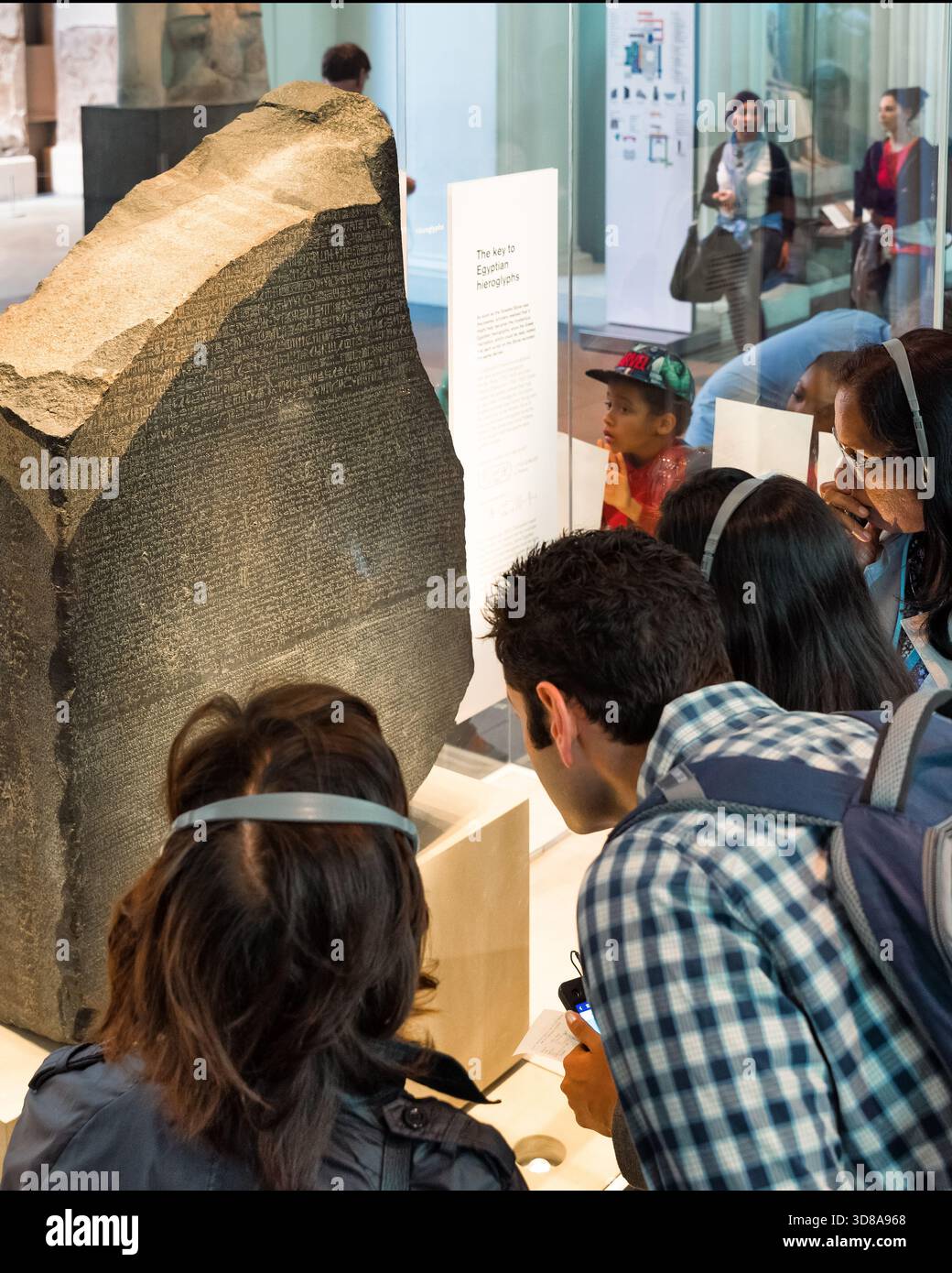 Visitors viewing rosetta stone exhibit hi-res stock photography and ...
