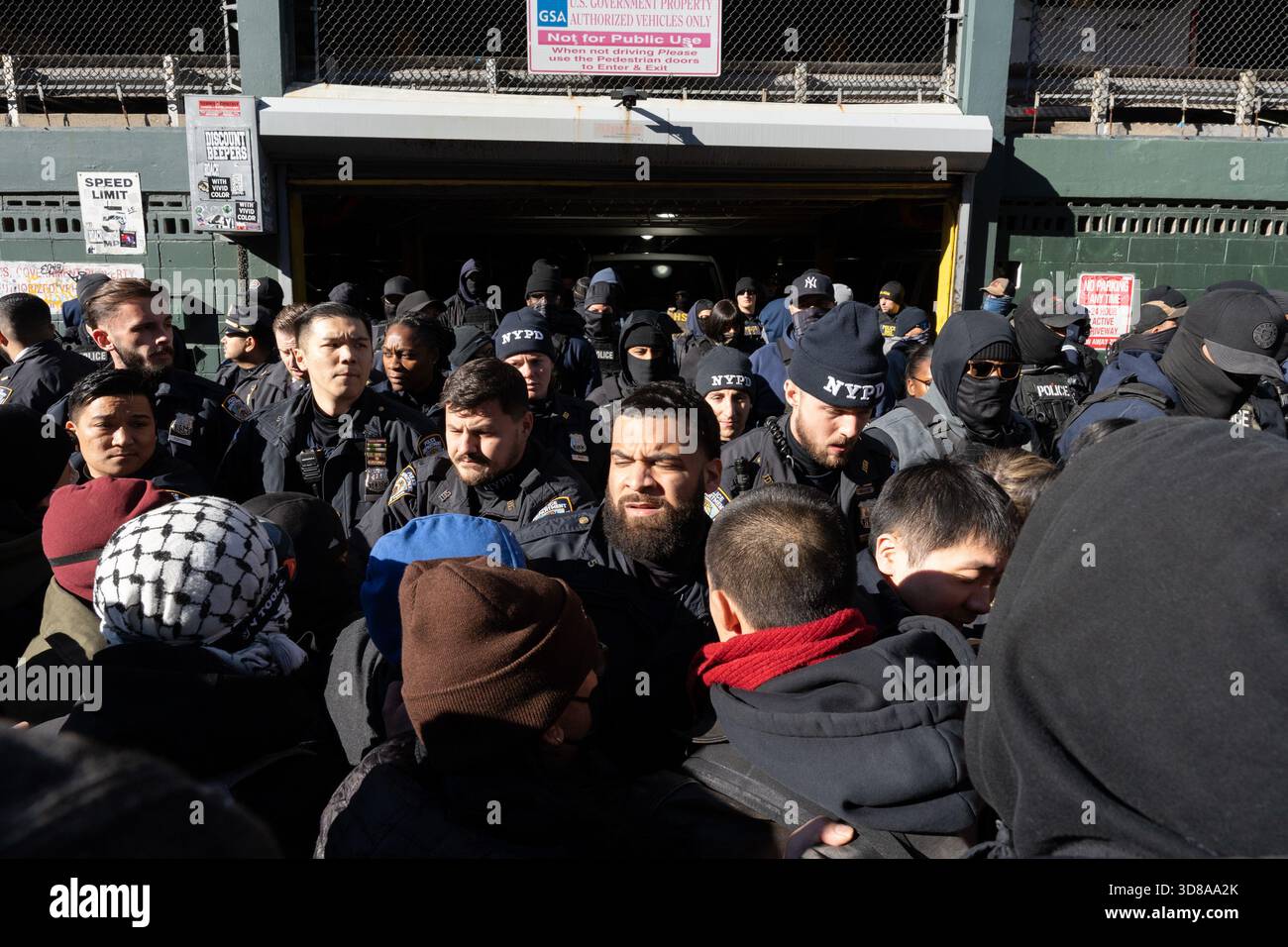 NYPD and protestors outside an ICE raid in Chinatown, NY on Saturday ...