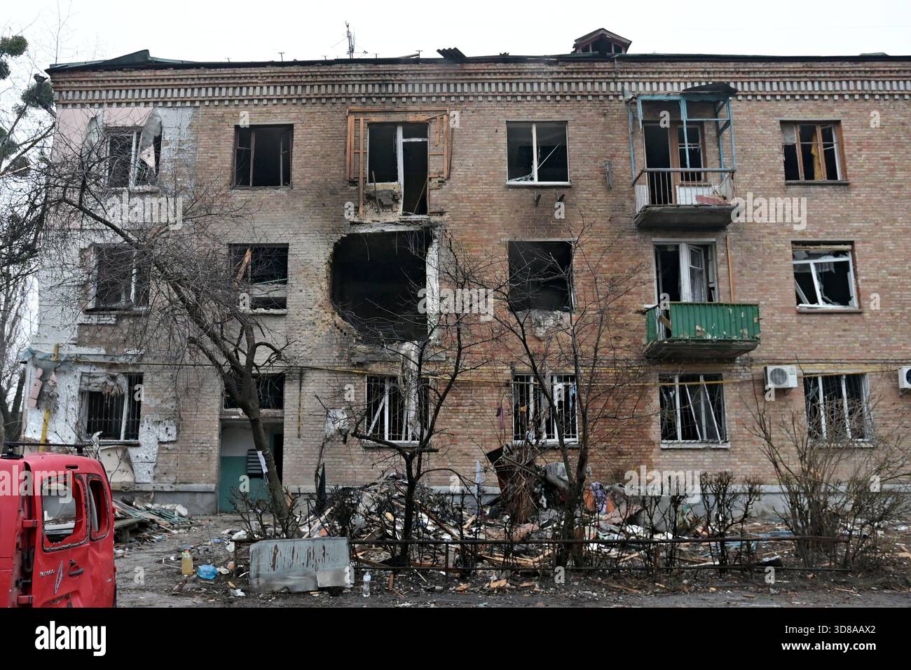 A residential building stands damaged by a Russian airstrike on ...