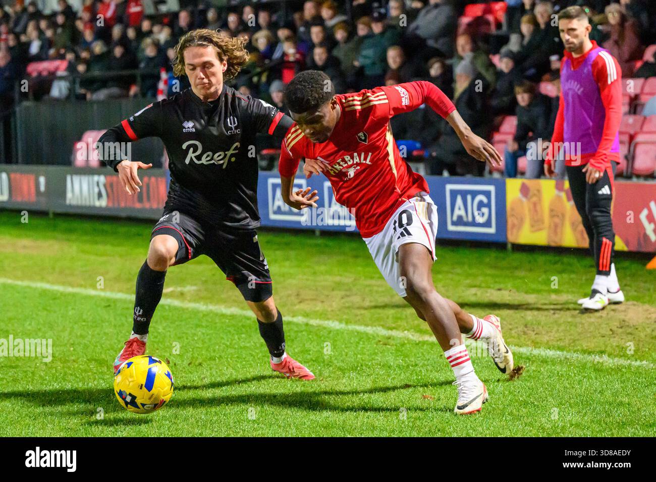 Harry Forster of Crawley Town tackles Kelly Nmai of Salford City FC ...
