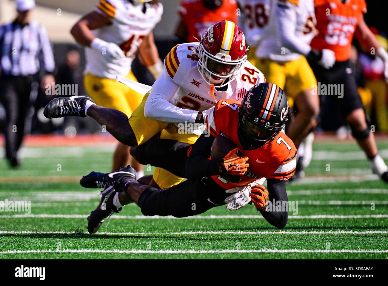 Iowa State defensive back Quentin Taylor (24) tackles Oklahoma State ...