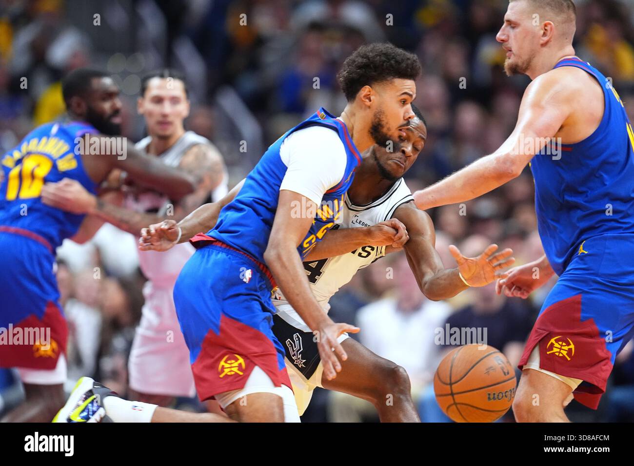 Denver Nuggets forward Cameron Johnson (23) and San Antonio Spurs guard ...