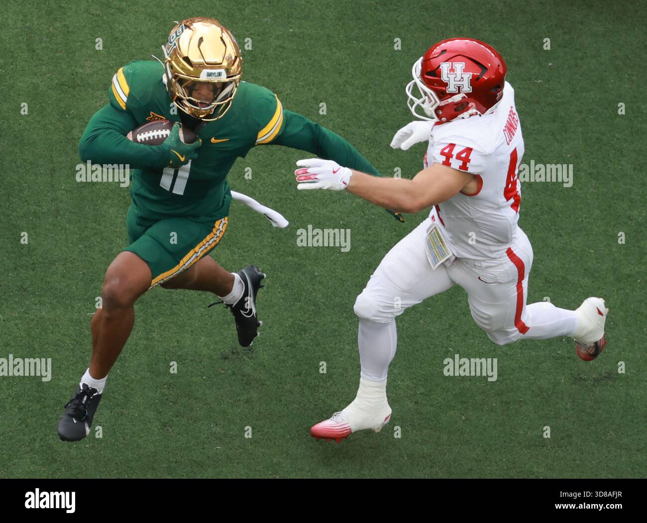 Baylor linebacker Keaton Thomas is pressured by Houston running back ...
