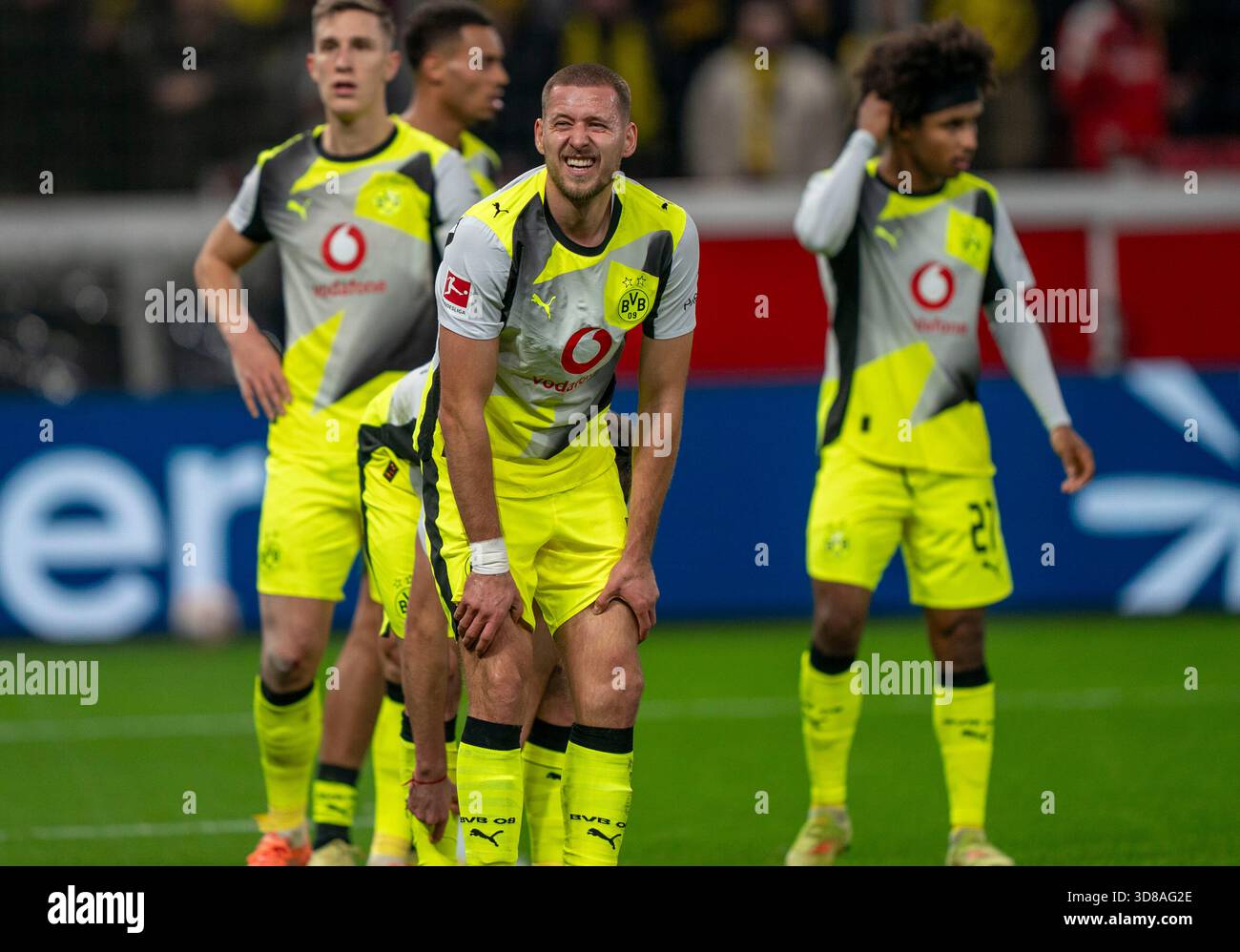 Waldemar ANTON (Borussia Dortmund, 3) in pain. 29.11.2025, Bayer ...