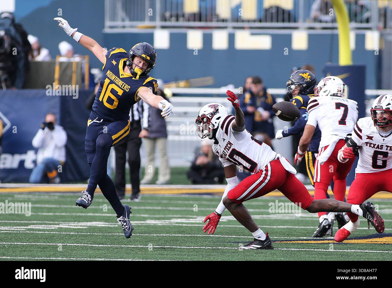 West Virginia wide receiver Jeff Weimer (16) misses a pass while defended by Texas Tech ...