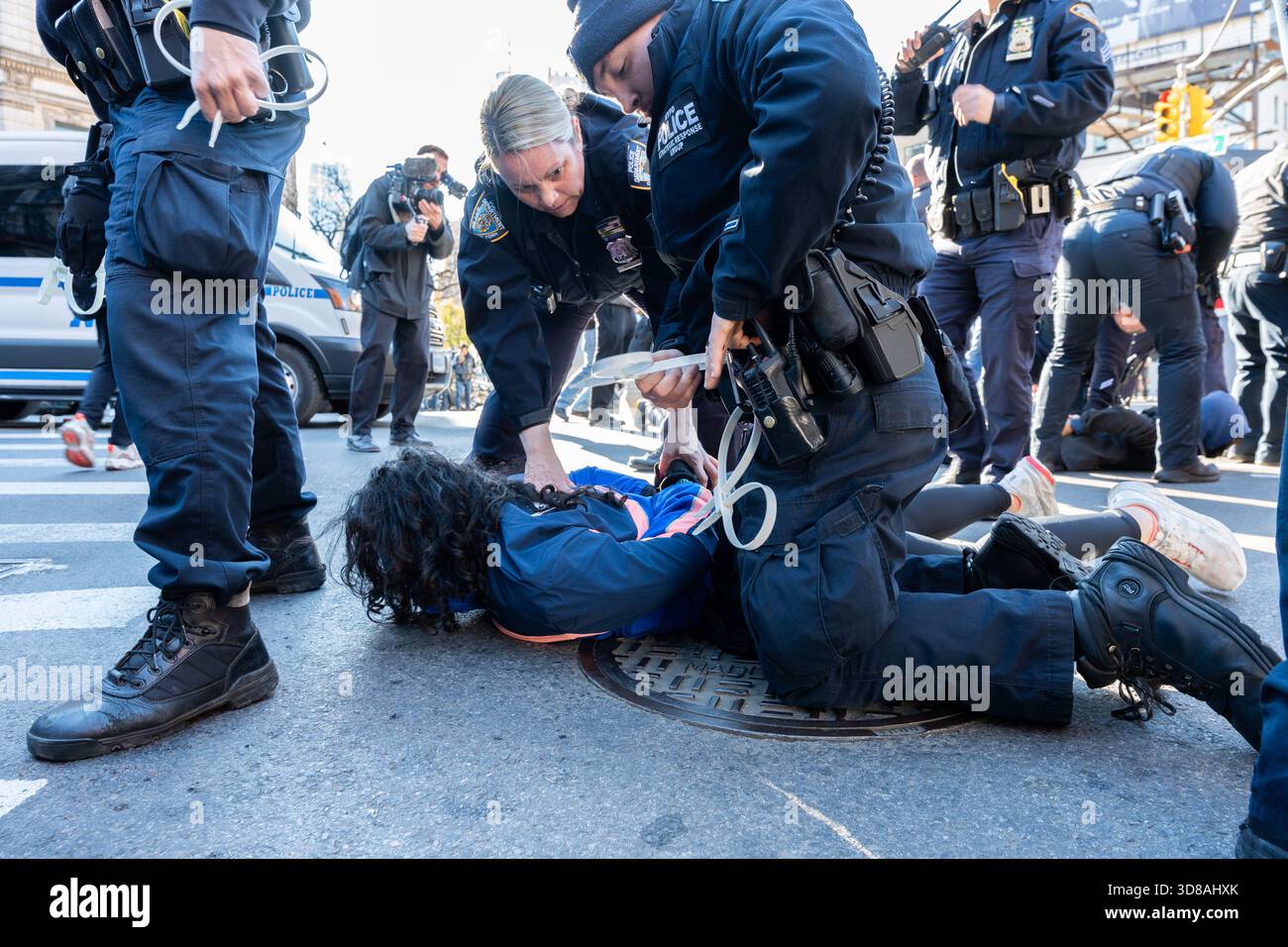 NYPD and protestors outside an ICE raid in Chinatown, NY on Saturday ...