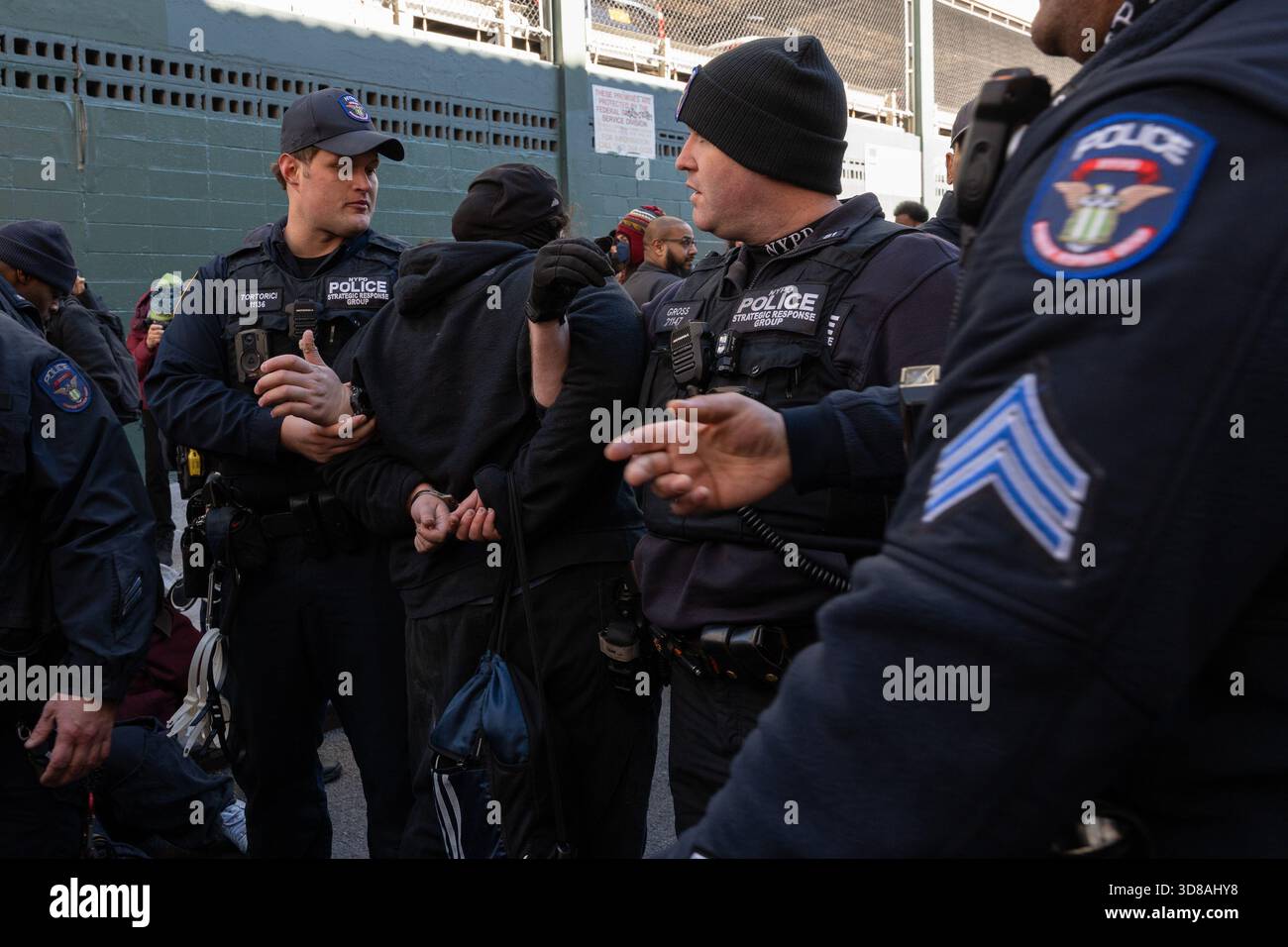 NYPD and protestors outside an ICE raid in Chinatown, NY on Saturday ...