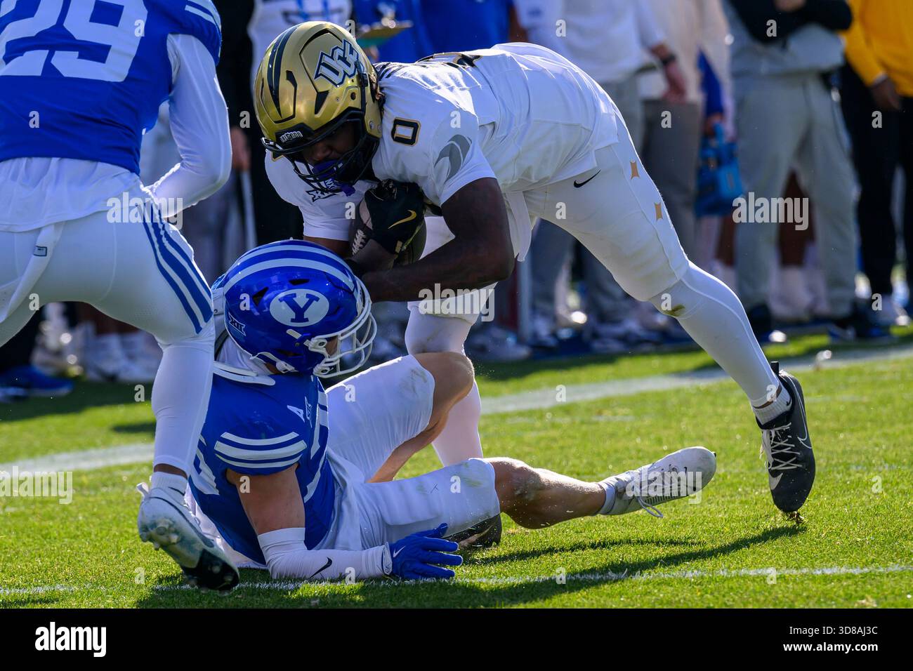 UCF tight end Dylan Wade, top, runs the ball after a catch tackled by ...