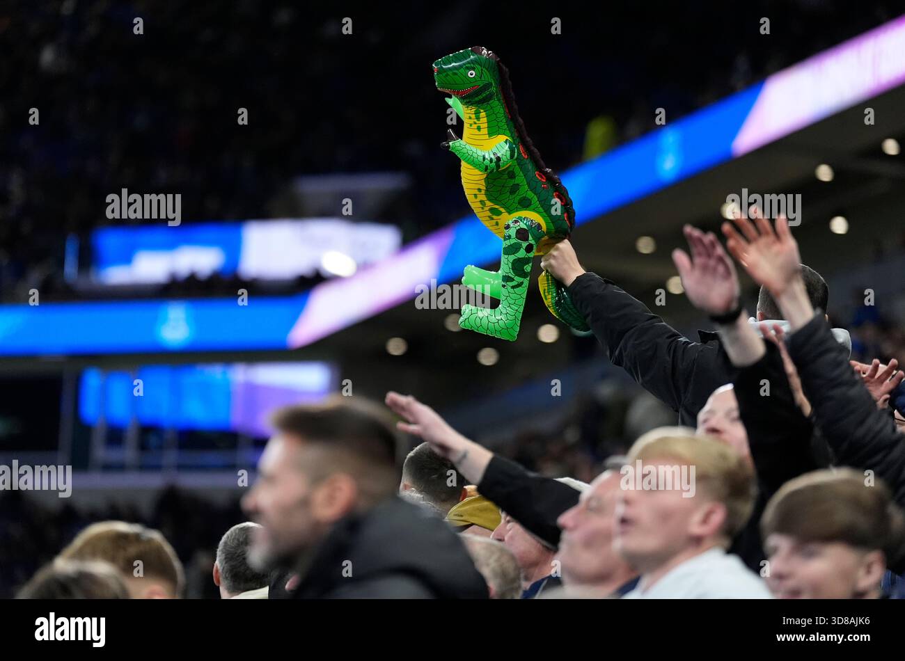 Newcastle United fans wave an inflatable Tyrannosaurus rex at Everton ...