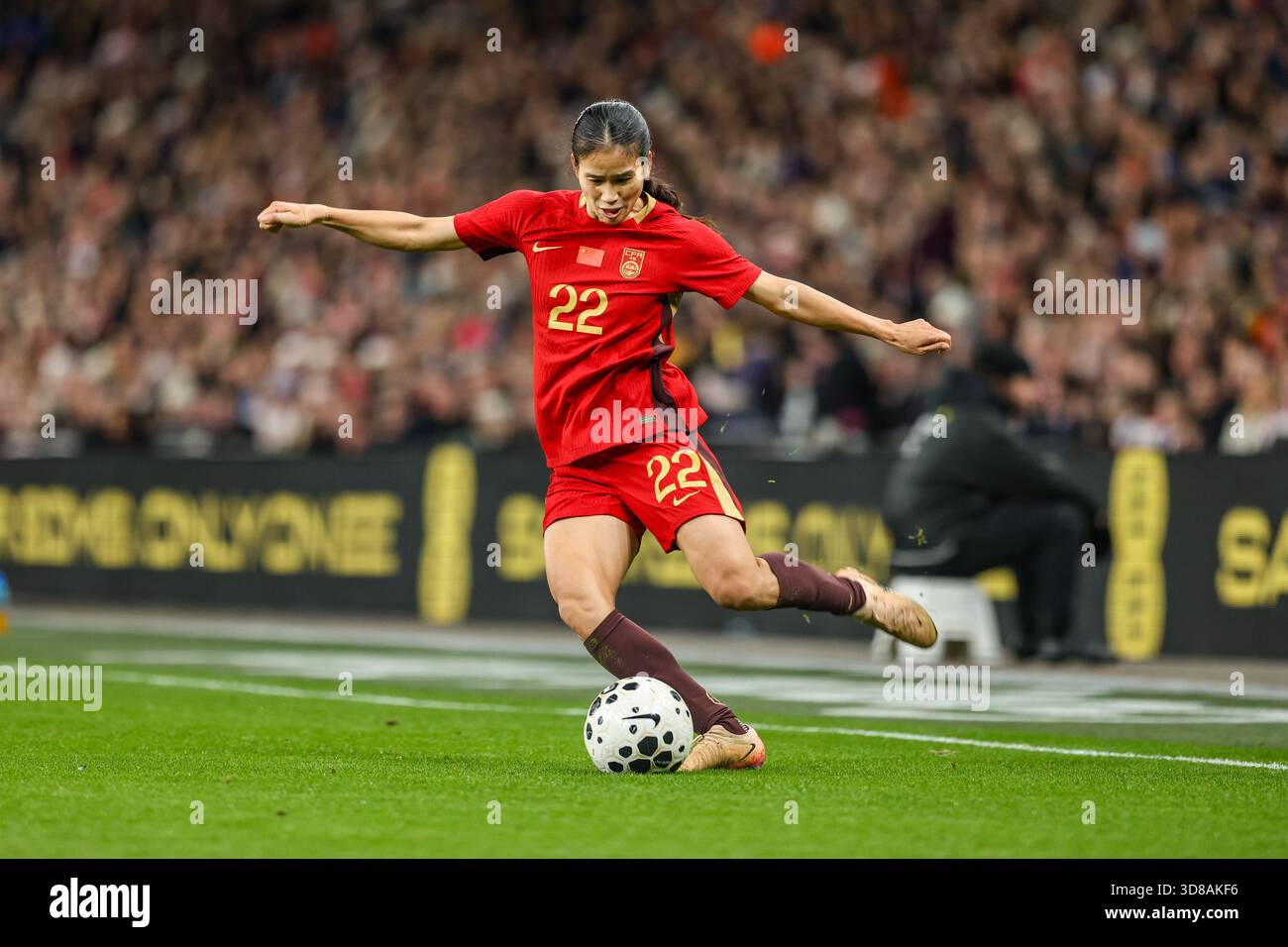 Qiaozhu Chen (22 China) passes the ball during the international ...