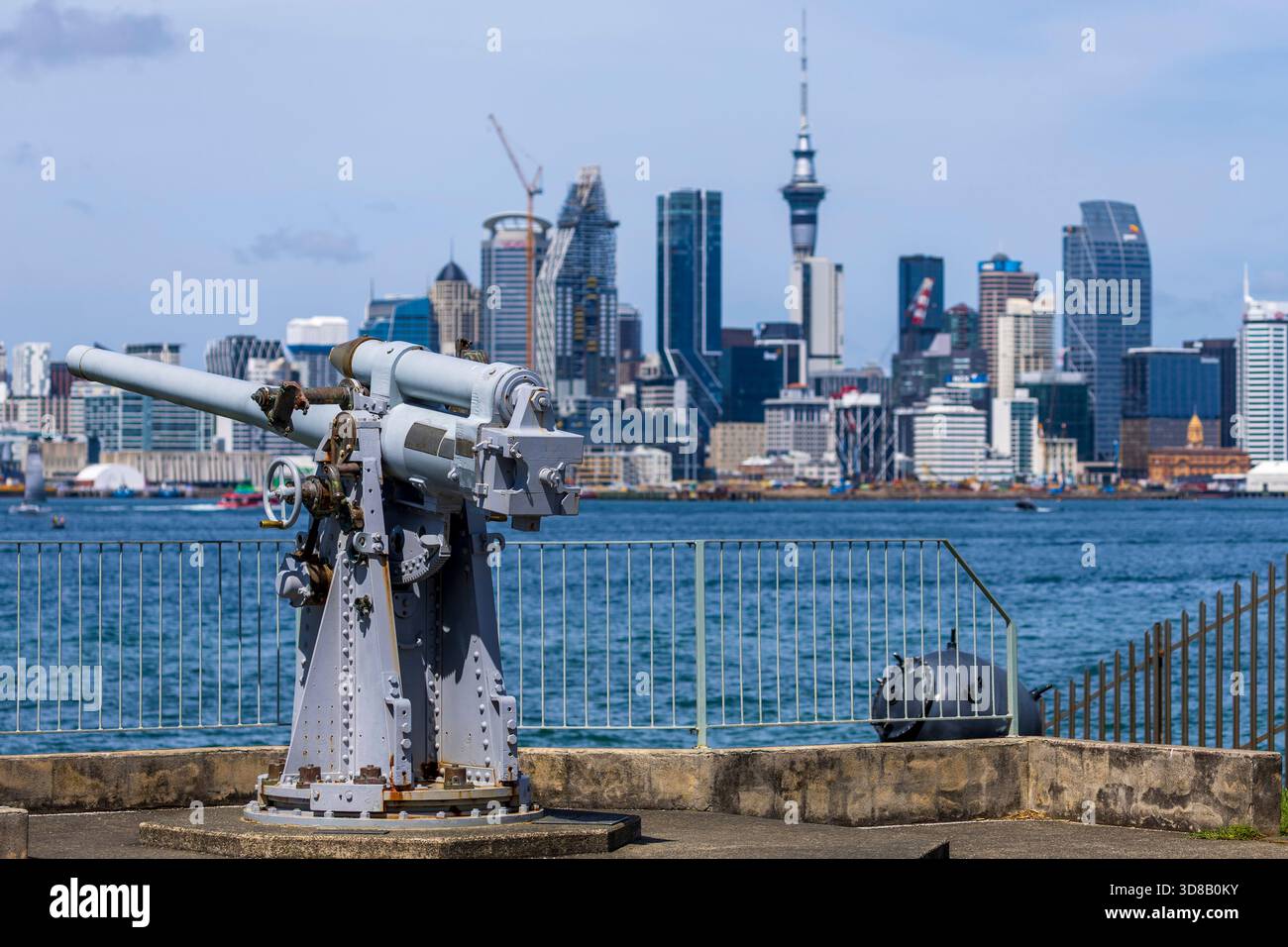Overlooking the city a naval gun stands outside the entrance to the New ...