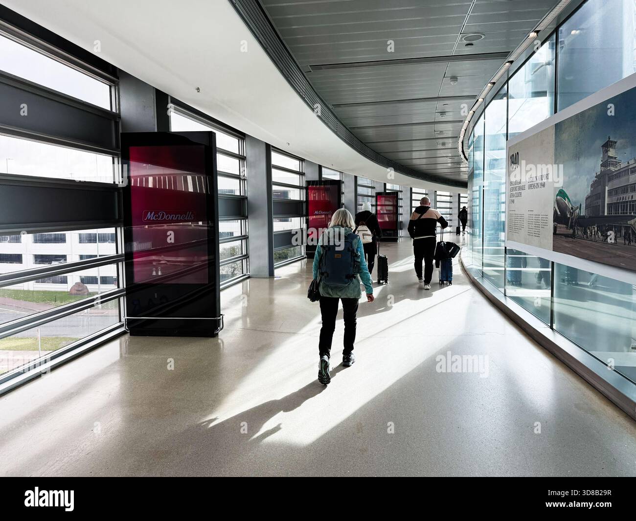 Dublin, Ireland - October 21, 2025: Passengers with backpacks walk ...
