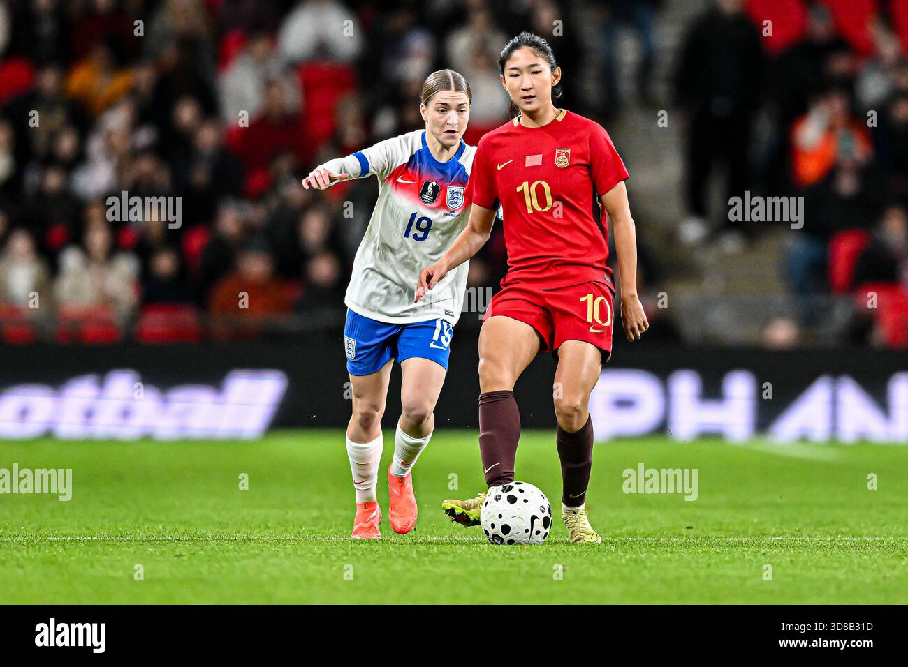 Yanwen Wang (10 China) controls the ball shadowed by Jess Park (19 ...