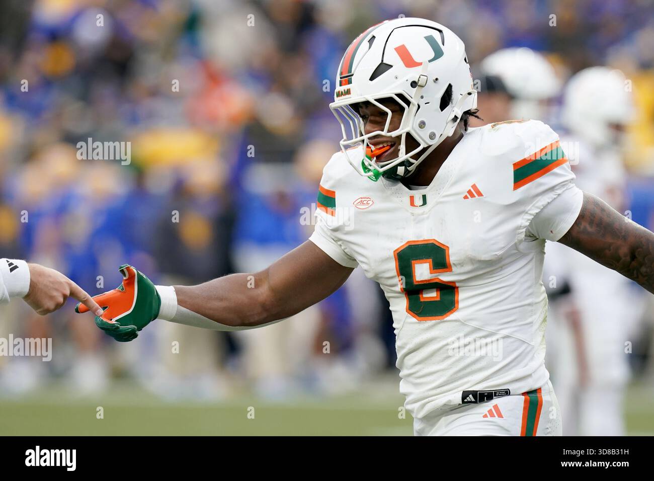 Miami running back Charmar Brown (6) celebrates after scoring during ...