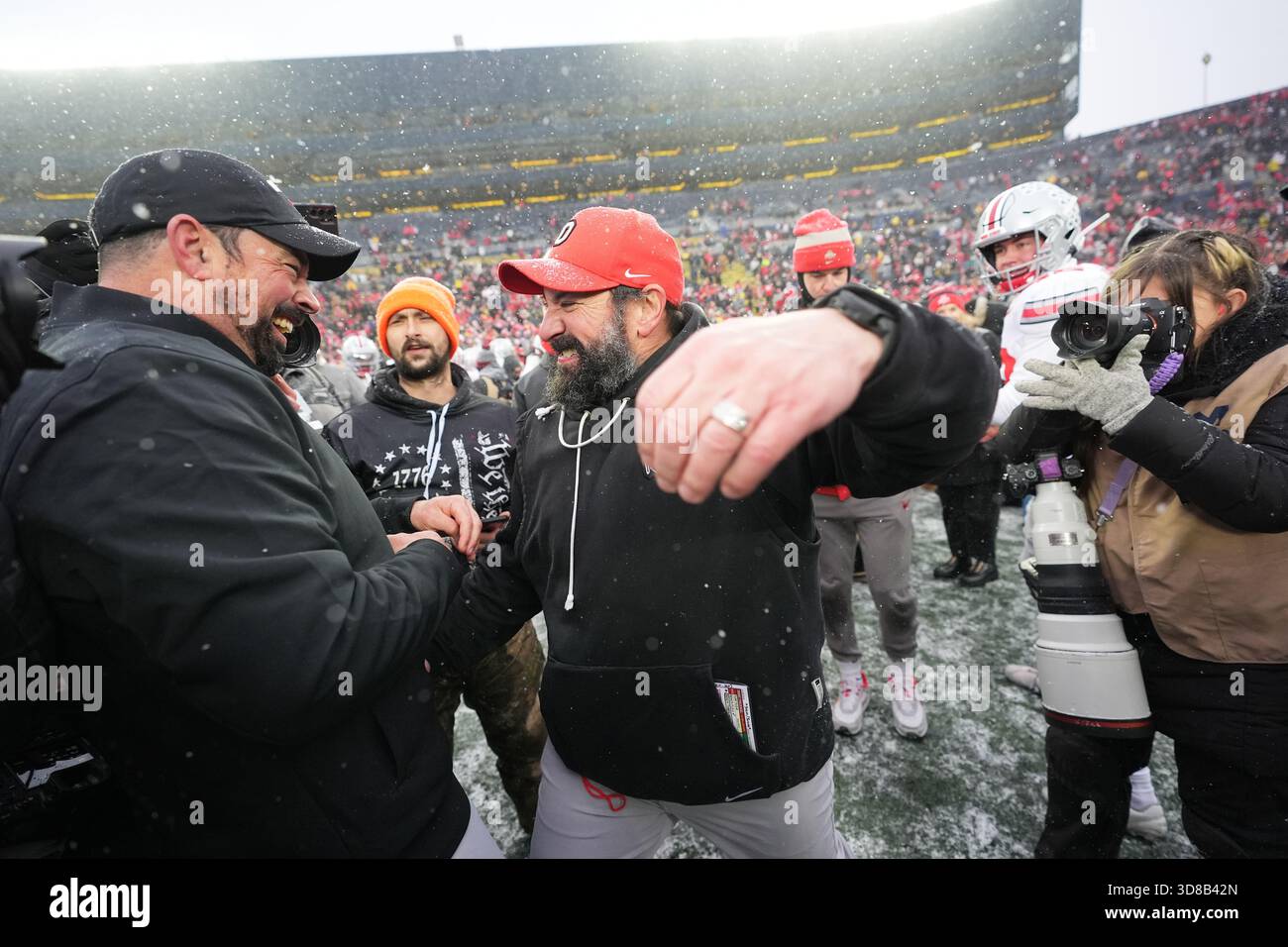 Ohio State Buckeyes head coach Ryan Day, left, celebrates with ...
