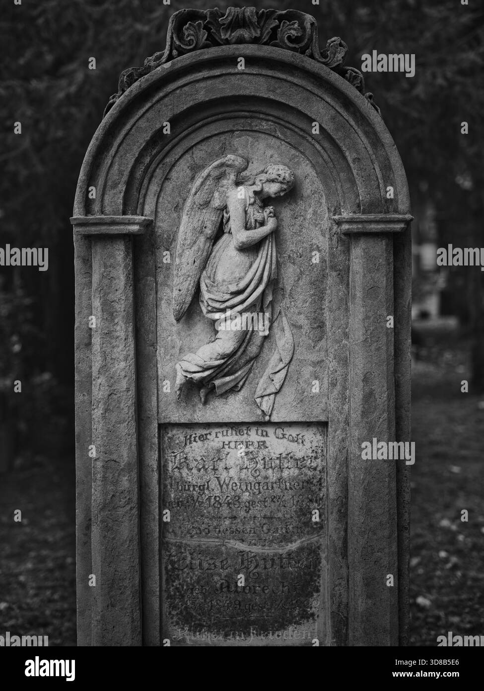 Black and white photograph of a historic gravestone with a carved angel ...