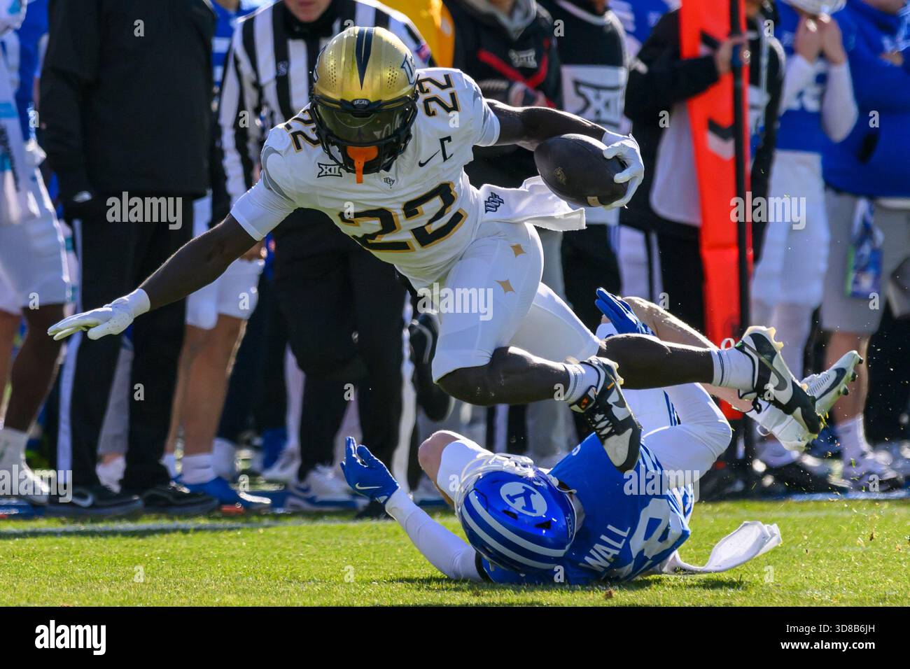 UCF running back Myles Montgomery, top, runs the ball tackled by BYU ...