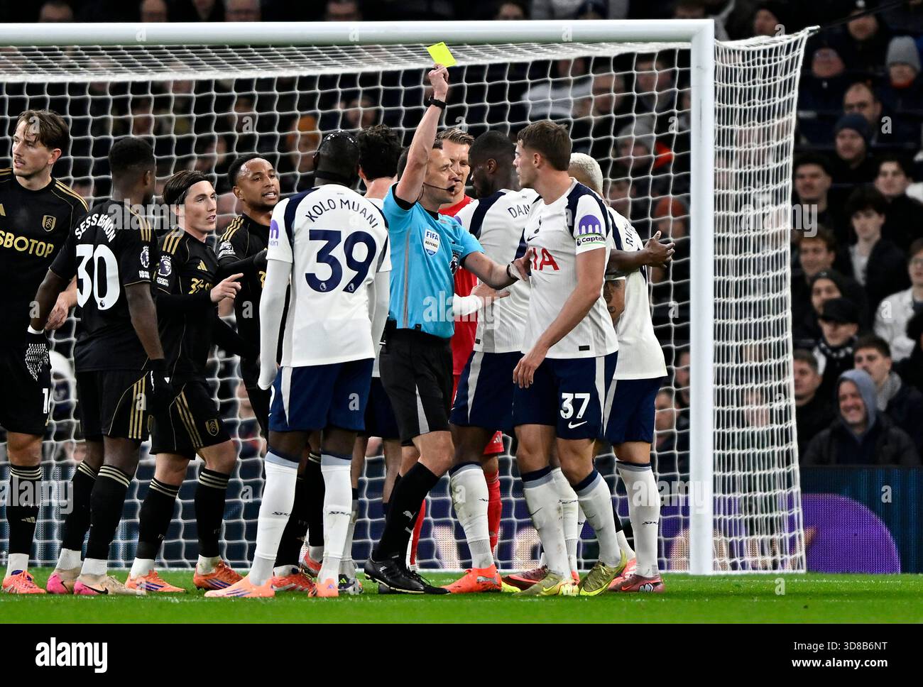 London UK 29th Nov 2025 Stuart Attwell (Referee) shows the yellow card ...