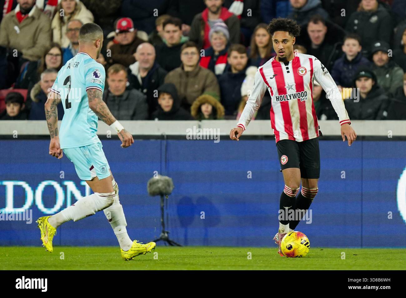 Kevin Schade of Brentford under pressure from Kyle Walker of Burnley ...