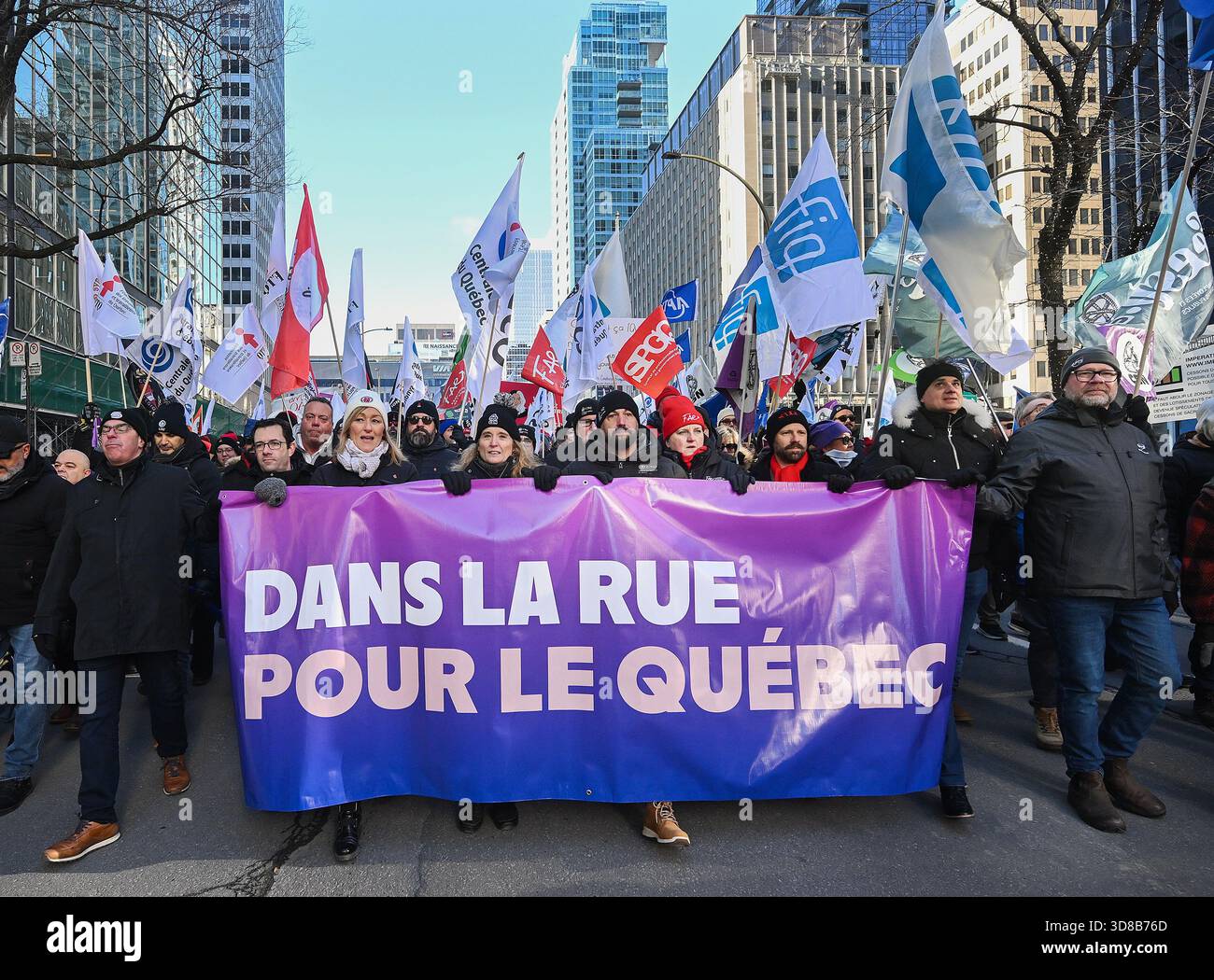 Union groups take part in a protest against the Quebec government's new ...