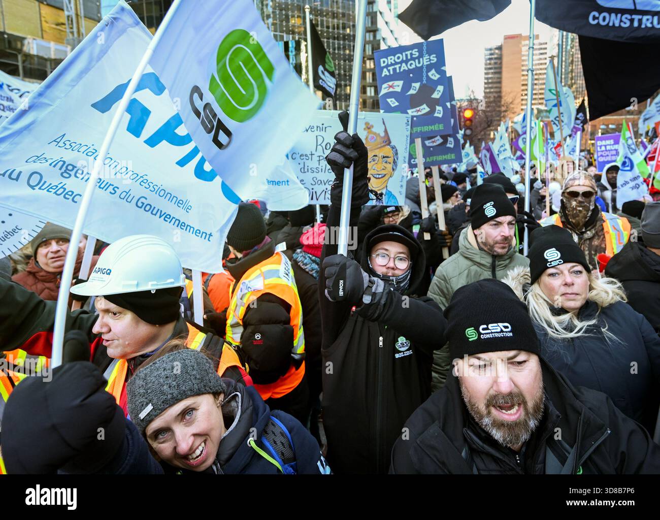 Union groups take part in a protest against the Quebec government's new ...