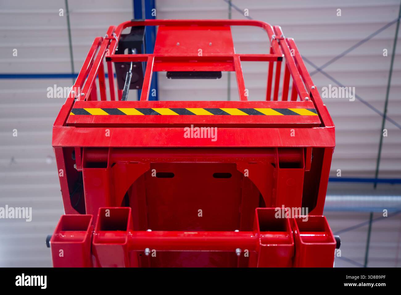 Heavy-duty scissor lift platform structure with metal railings and ...