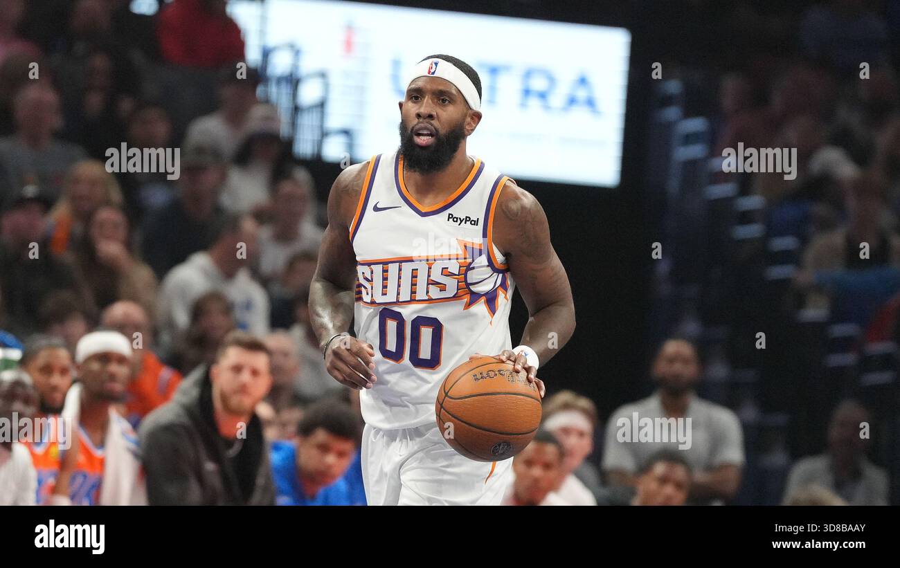 Phoenix Suns forward Royce O'Neale pushes down the court during the ...